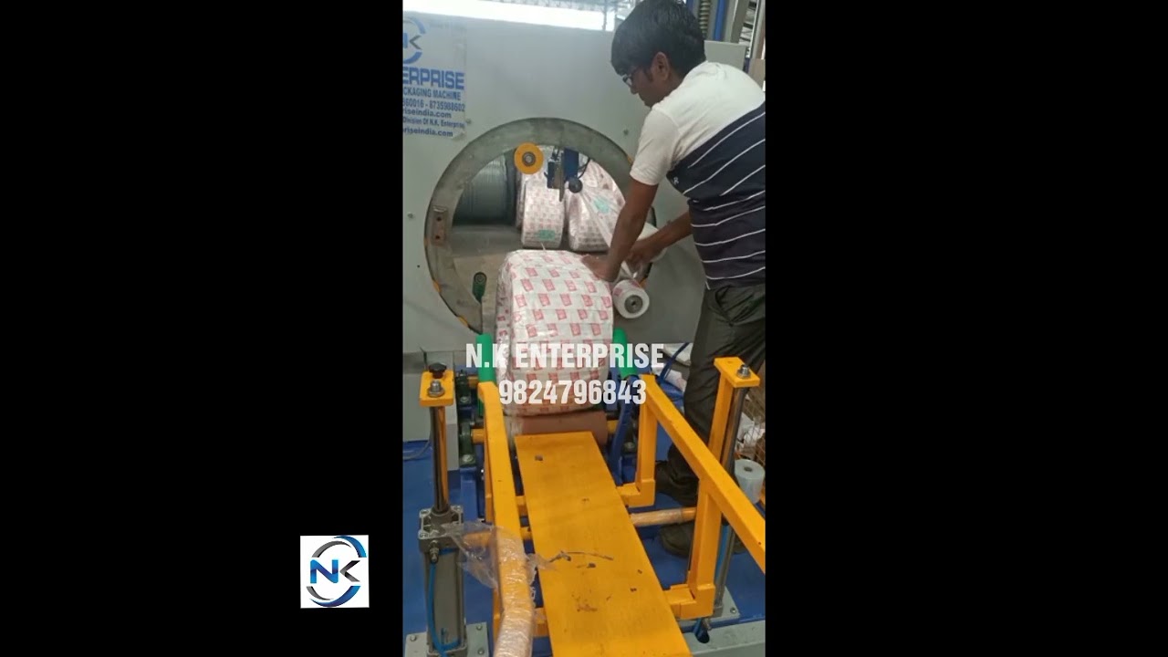 Vertical coil wrapping machine with automatic coil loading/unloading ...