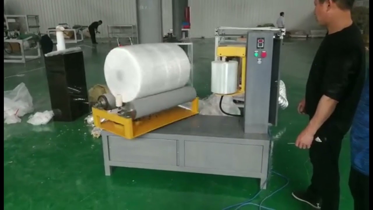 Compact horizontal pallet wrapping machine. - CUSTOMIZED WRAPPING SOLUTIONS